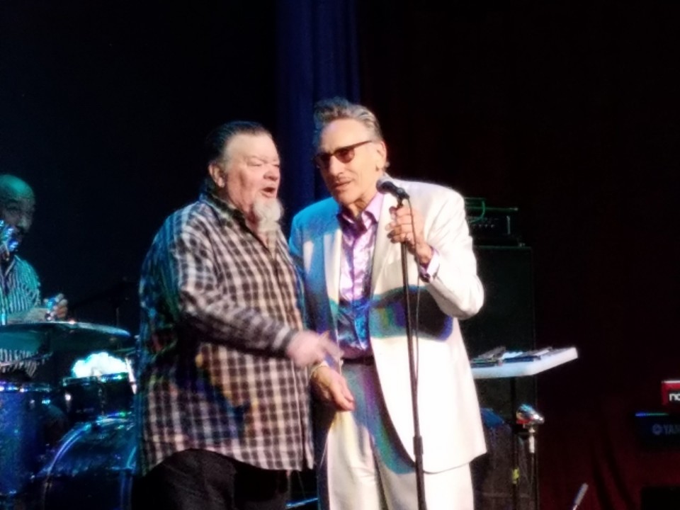 Harman with Rick Estrin.